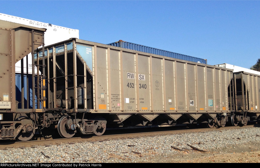 RWSX 452340 empty Georgia Power 5-bay aluminum coal hopper in a BNSF wesbound on the NS through ...
